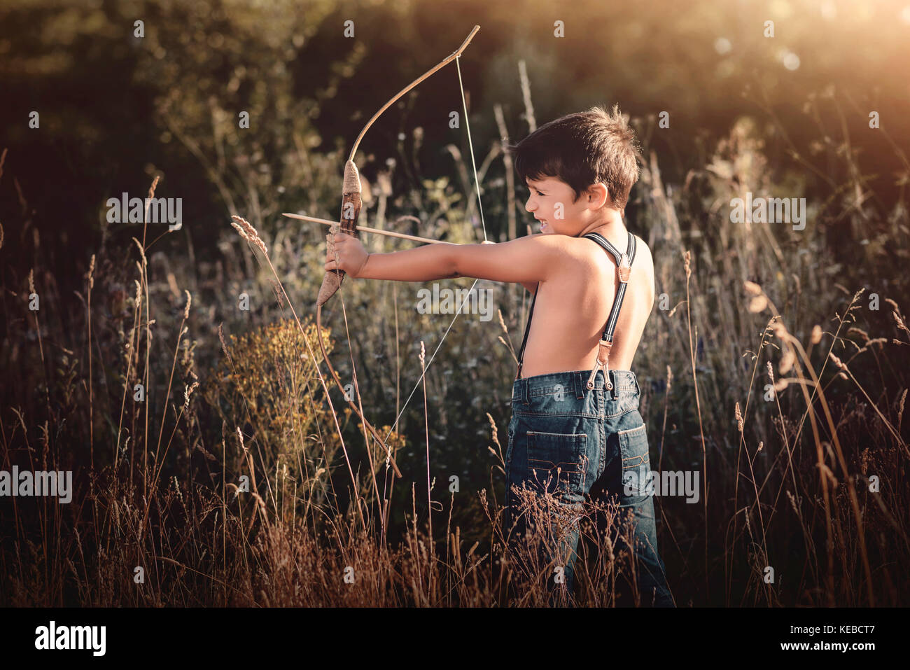 archer boy, child playing with a bow and arrows Stock Photo - Alamy