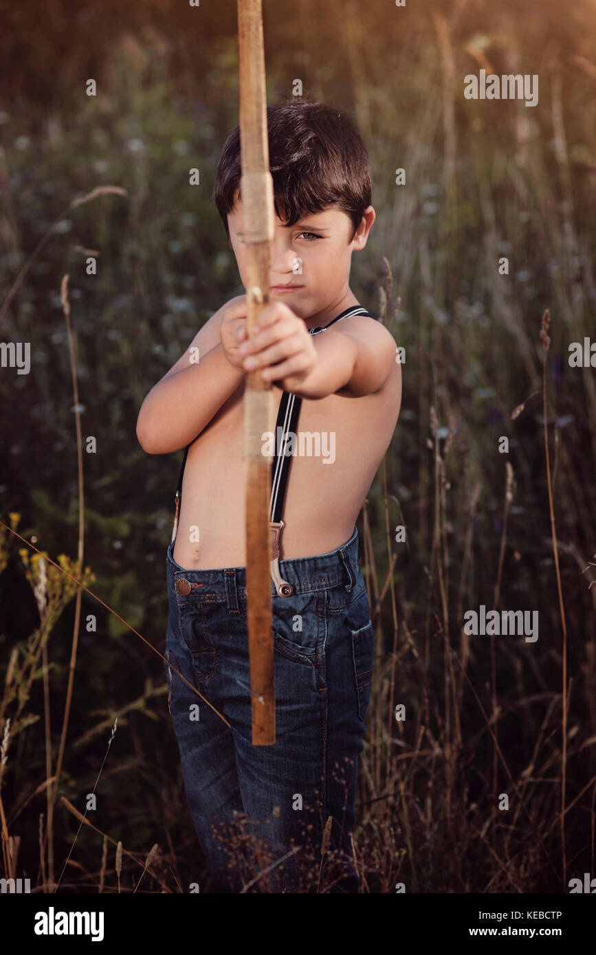 archer boy, child playing with a bow and arrows Stock Photo - Alamy