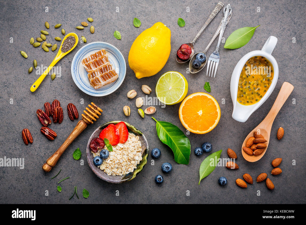 Ingredients for the healthy foods background Mixed nuts, honey, berries ...