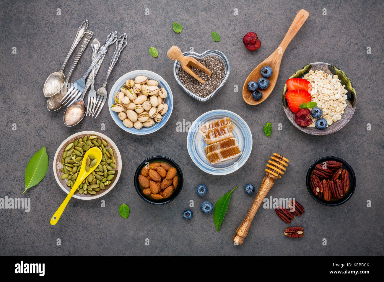 Ingredients for the healthy foods background Mixed nuts, honey, berries ...