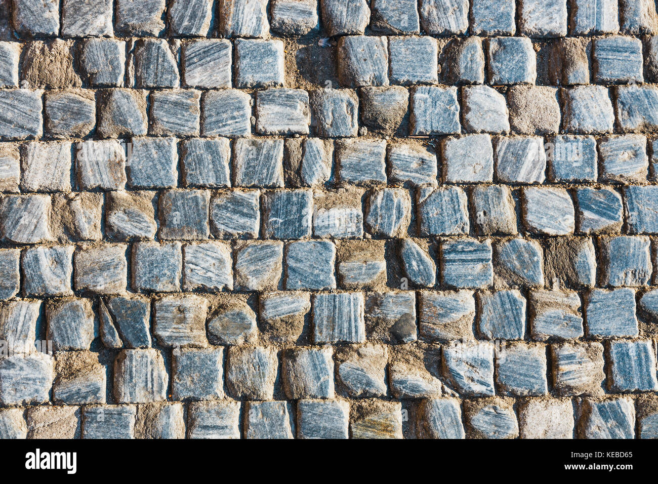 Gray stone road texture at sunny day Stock Photo - Alamy