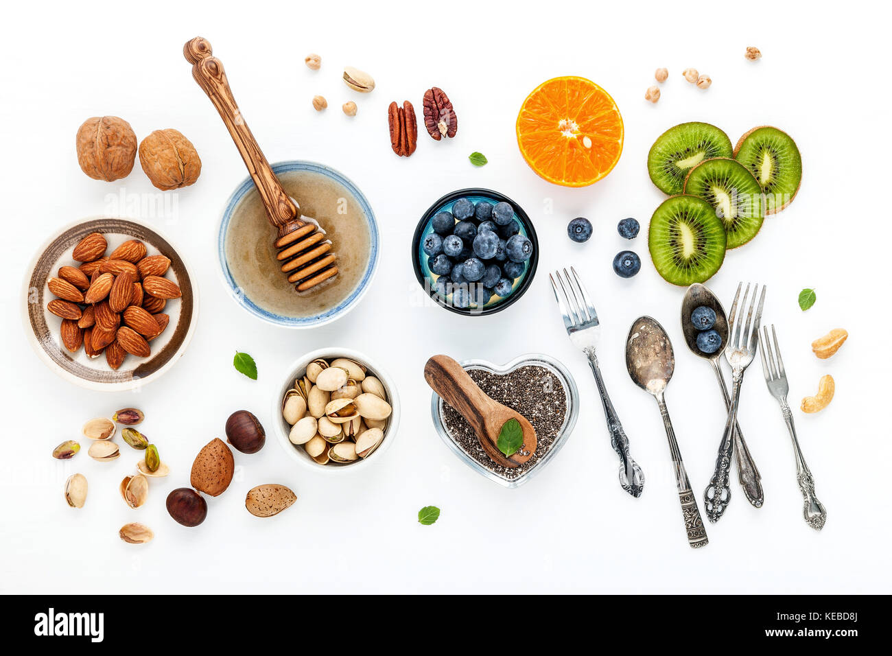 Ingredients for a healthy foods background, nuts, honey, berries ...