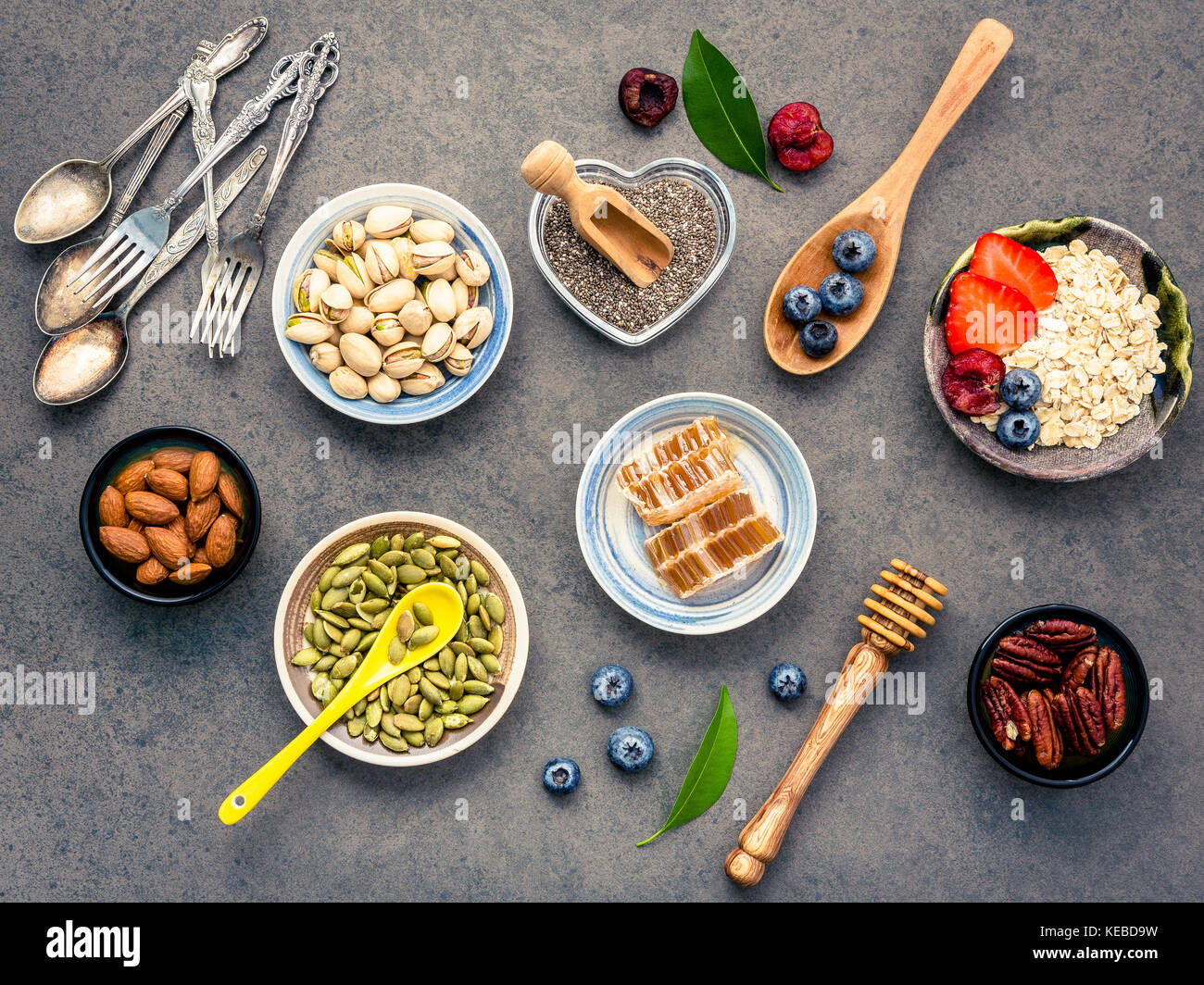 Ingredients for the healthy foods background Mixed nuts, honey, berries ...