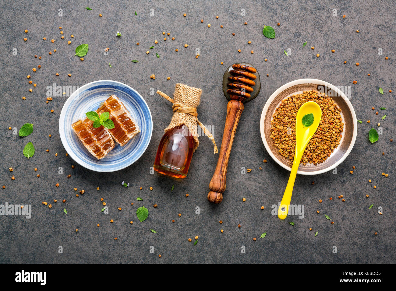Raw organic bee pollen on dark stone background. Bee pollen granules ...