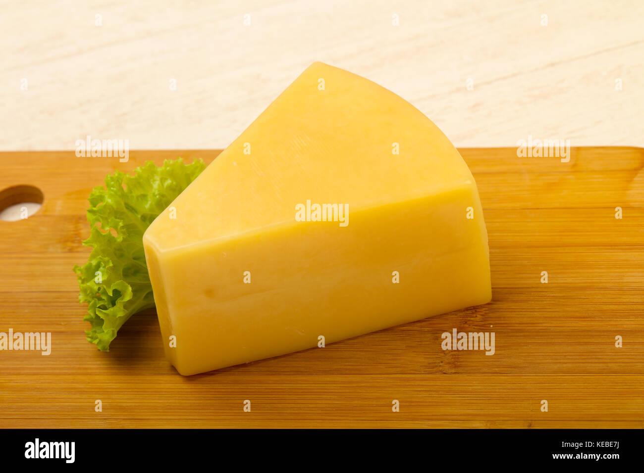 Parmesan cheese triangle Stock Photo - Alamy