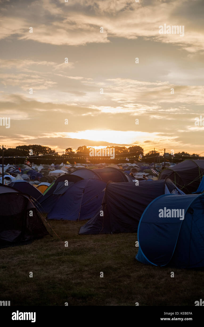Camping at sunset at a festival Stock Photo - Alamy