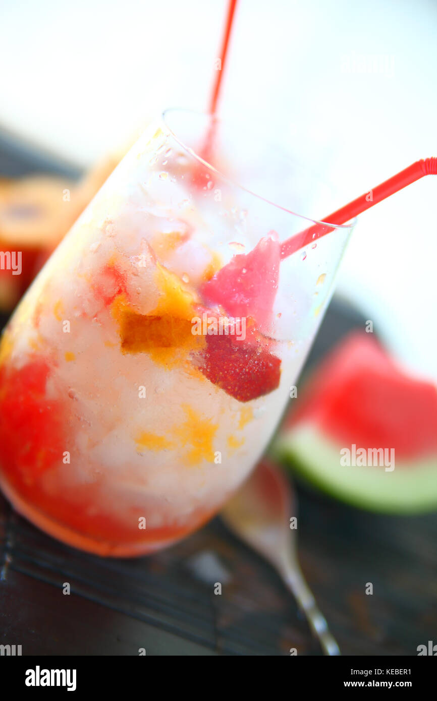 Icy drink made with watermelon, fresh peaches, crushed ice and ...