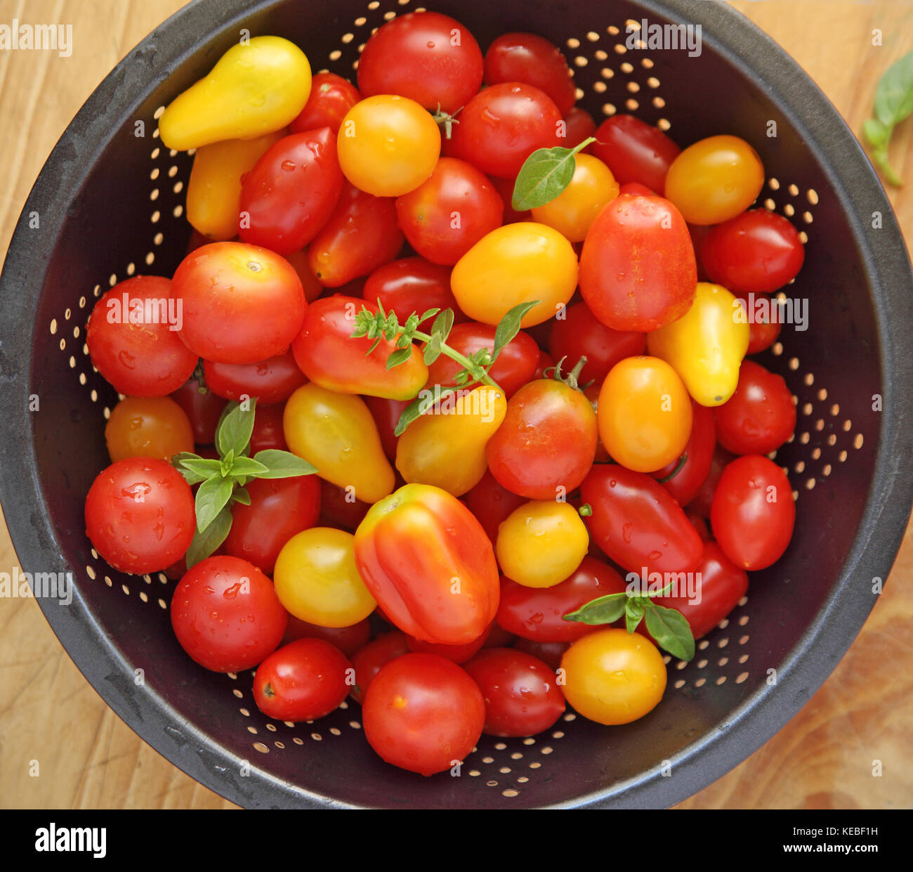 Various shapes and colors of cherry tomatoes from overhead with ...
