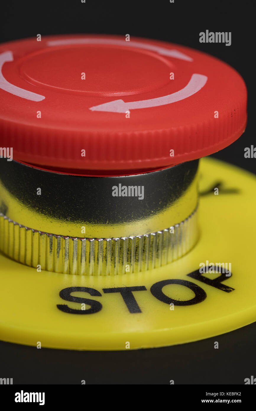 Big red button on dark background - metaphor for 'Finger on the Button ...