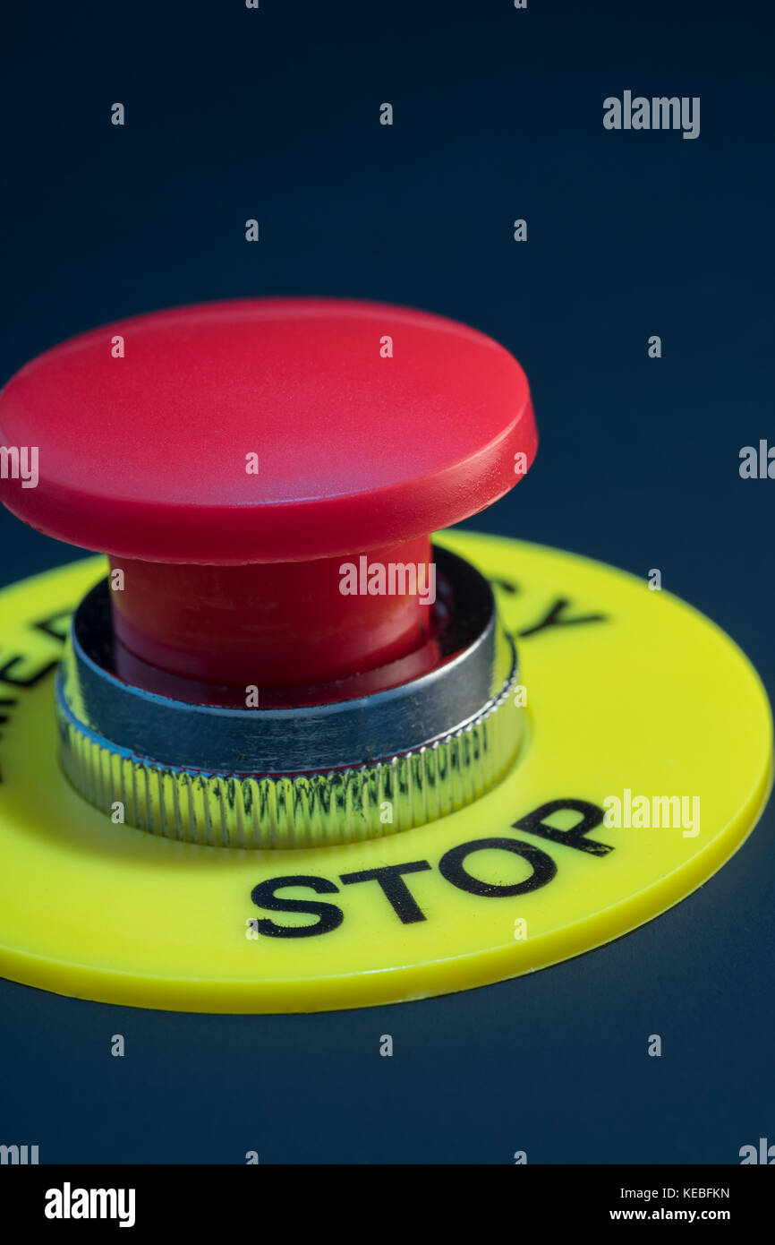 Big red button on dark background - metaphor for 'Finger on the Button ...