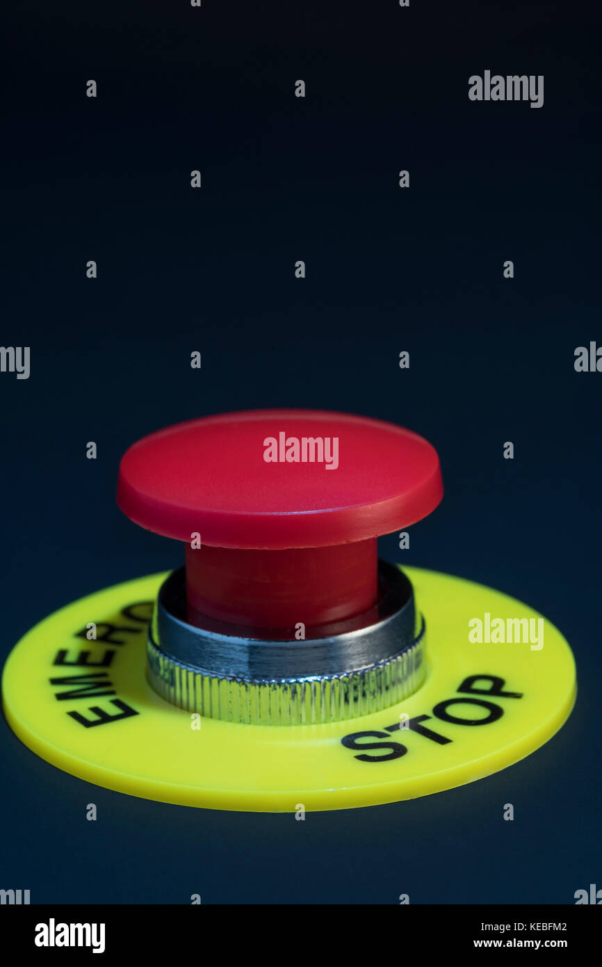 Big red button on dark background - metaphor for 'Finger on the Button ...