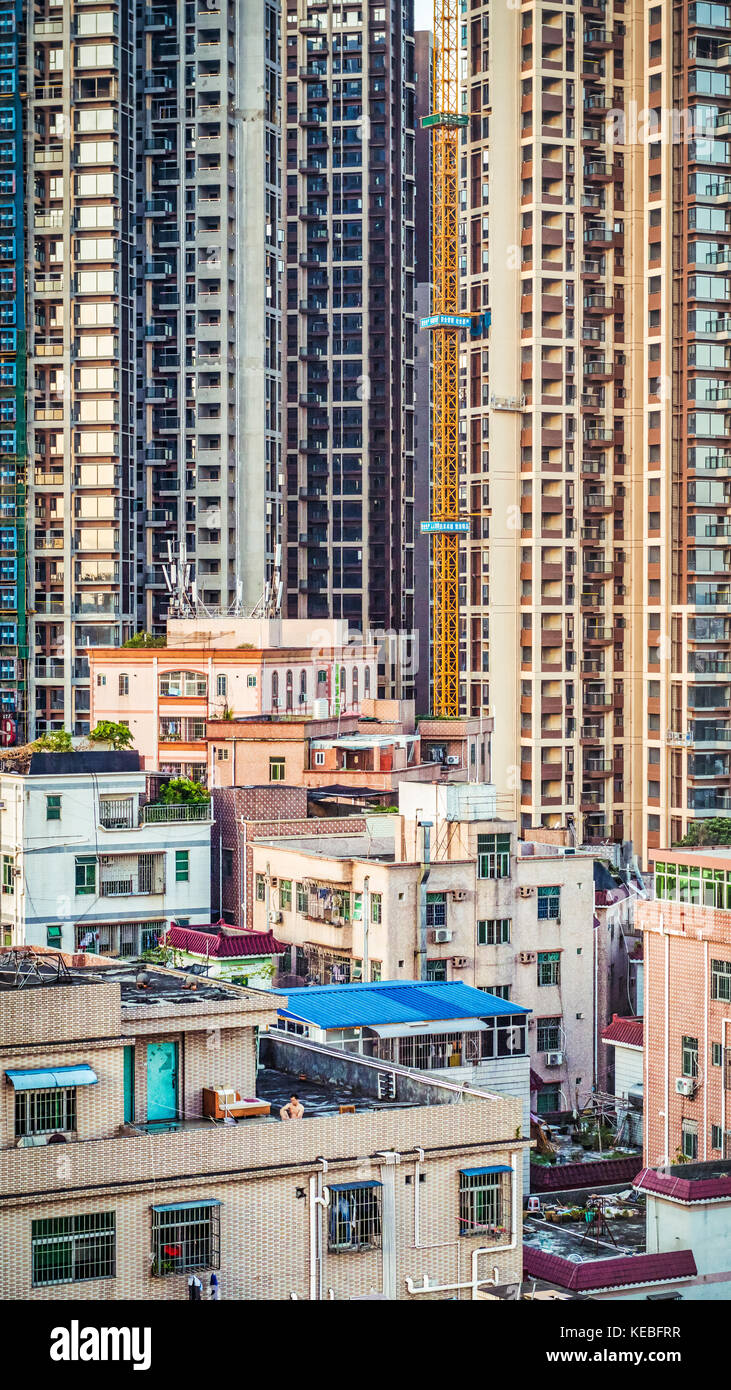 A 40 storey wall of new apartments are under construction next to an ...