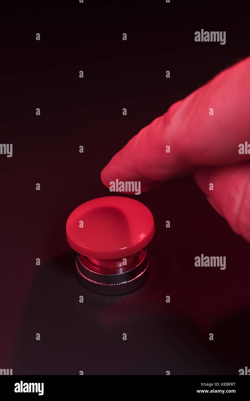 Big red button - metaphor for 'Finger on the Button'. Photographer's ...