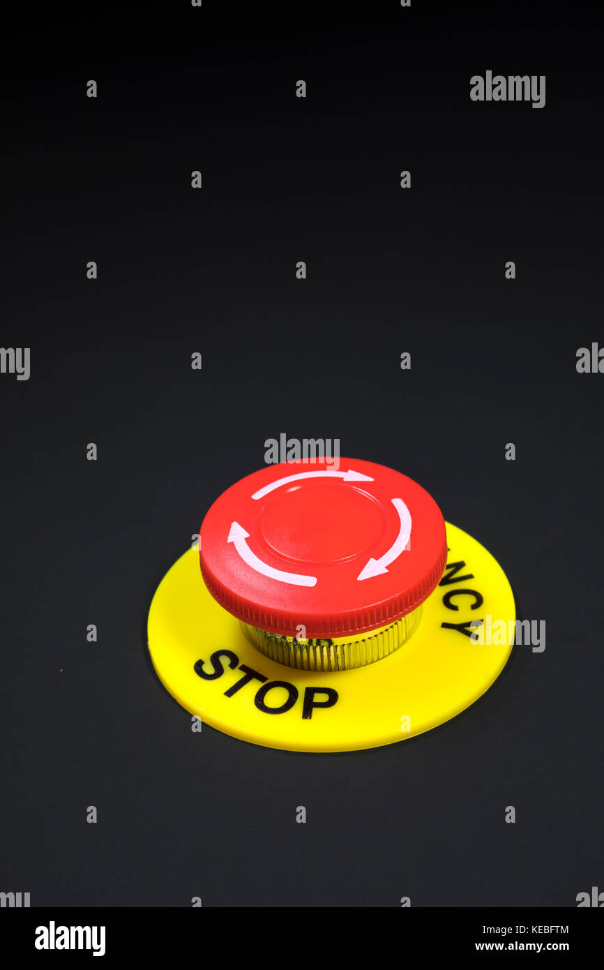 Big red button on dark background - metaphor for 'Finger on the Button ...