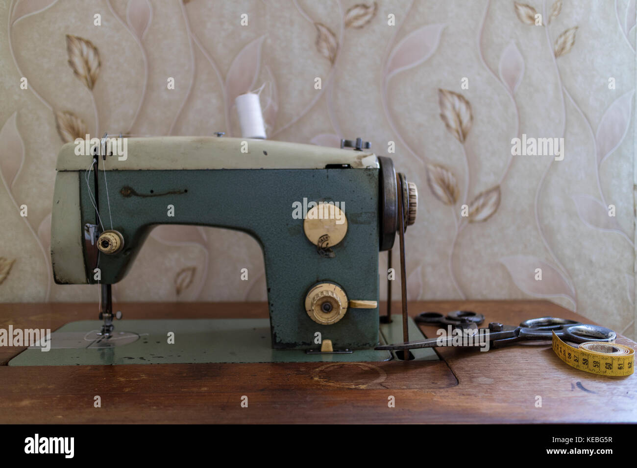 Retro sewing machine in an old house Stock Photo - Alamy