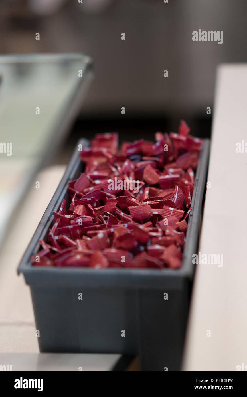 red sachets with sugar in a box Stock Photo - Alamy