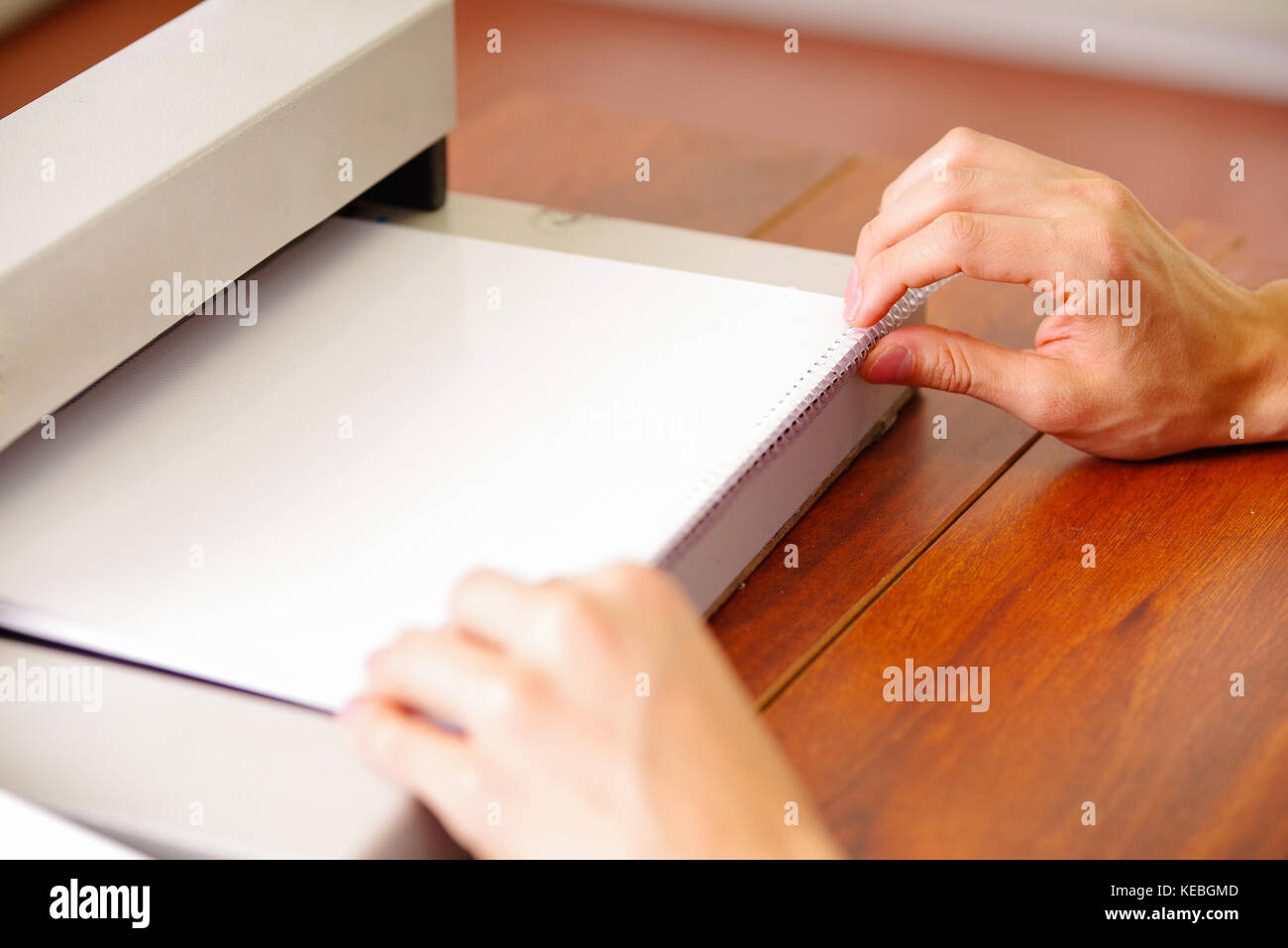 Man organizing the documents using his hands to binding documents using ...