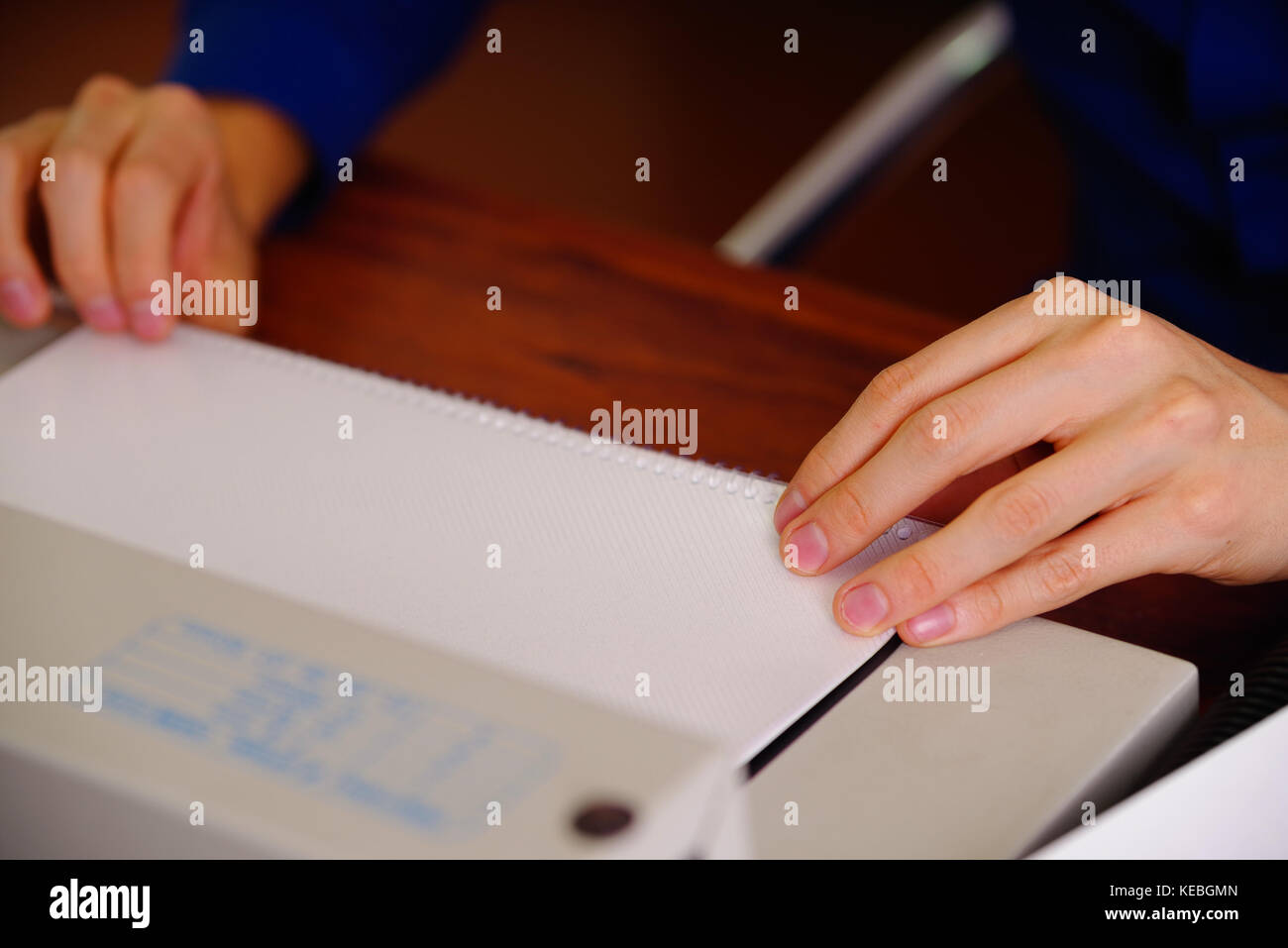 Man organizing the documents using his hands to binding documents using ...