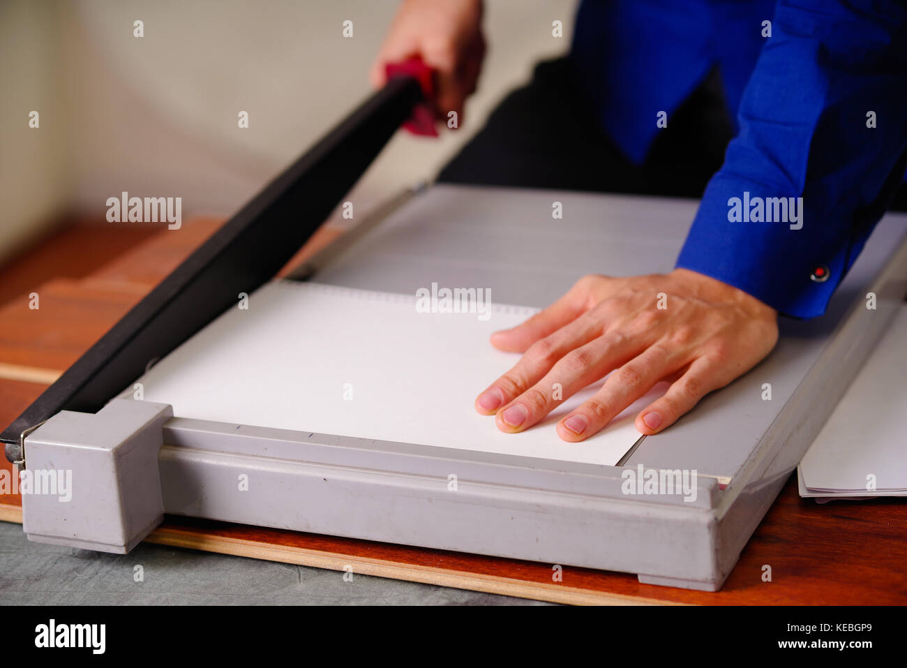 Close up of hand man over the guillotine, working on the guillotine ...