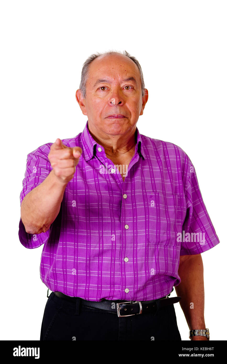 Portrait of a happy old man, pointing with his hand to somewhere ...