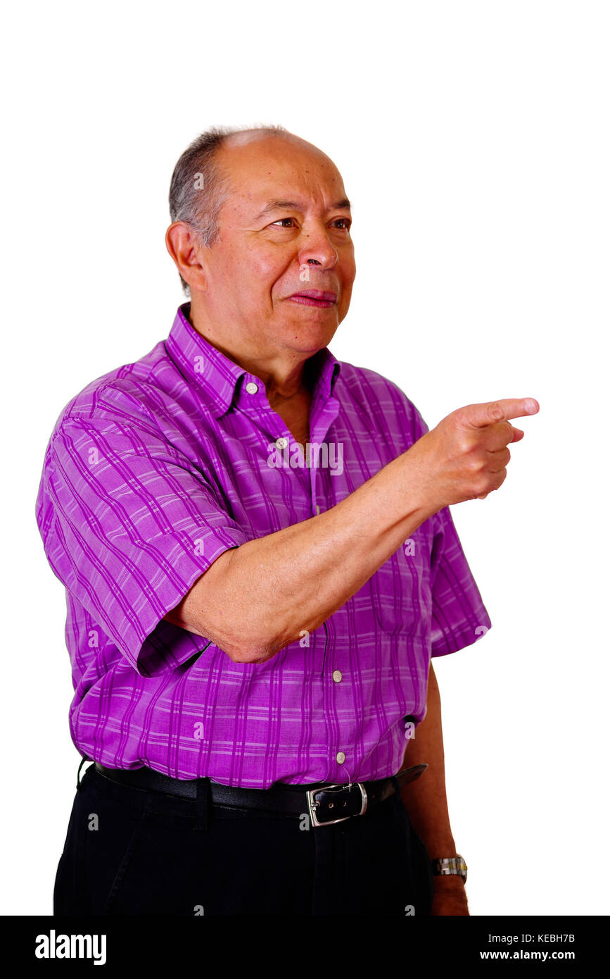 Portrait of a happy old man, pointing with his hand to somewhere ...