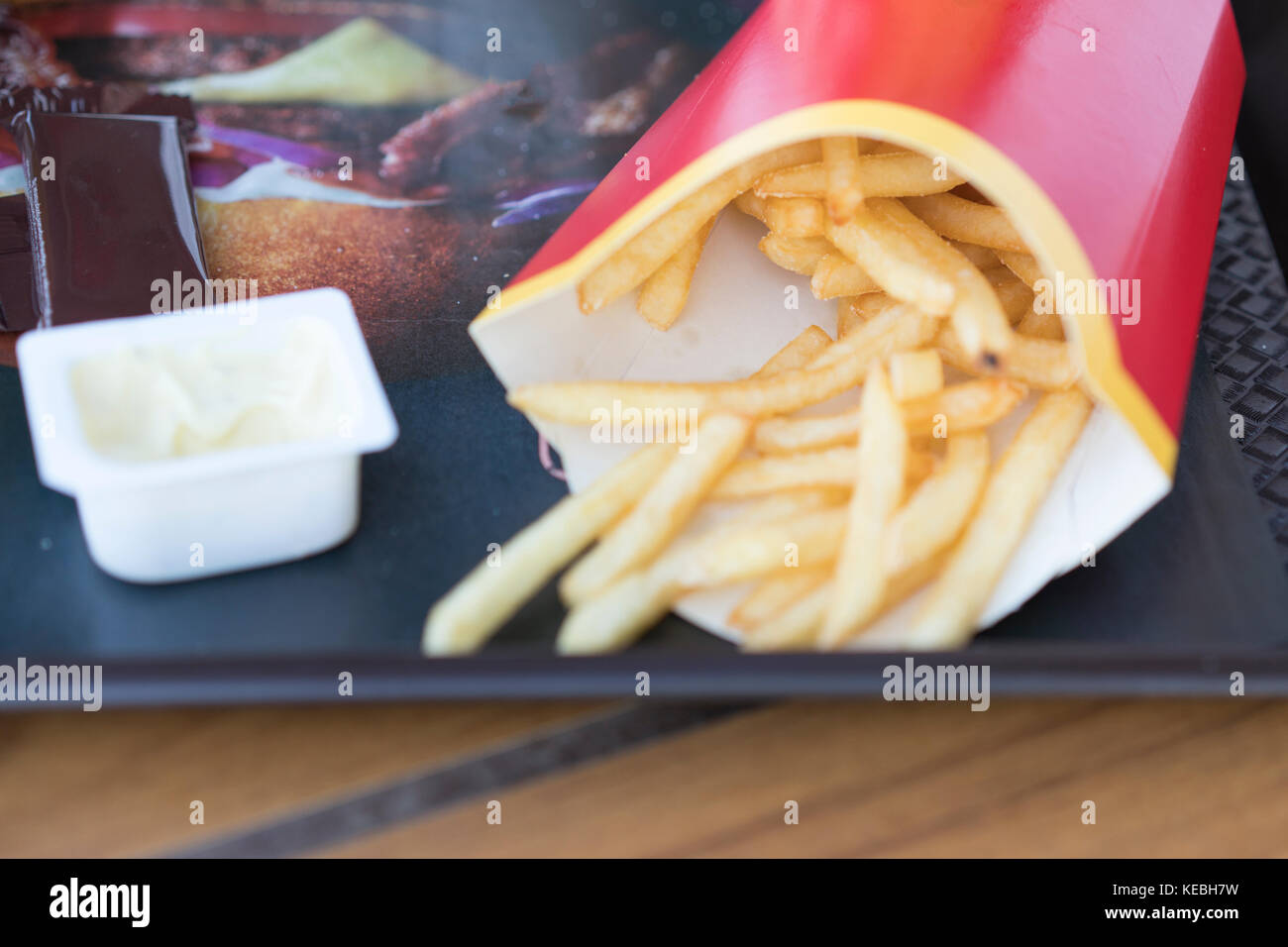 Fast food. French fries and sauce on a tray Stock Photo - Alamy