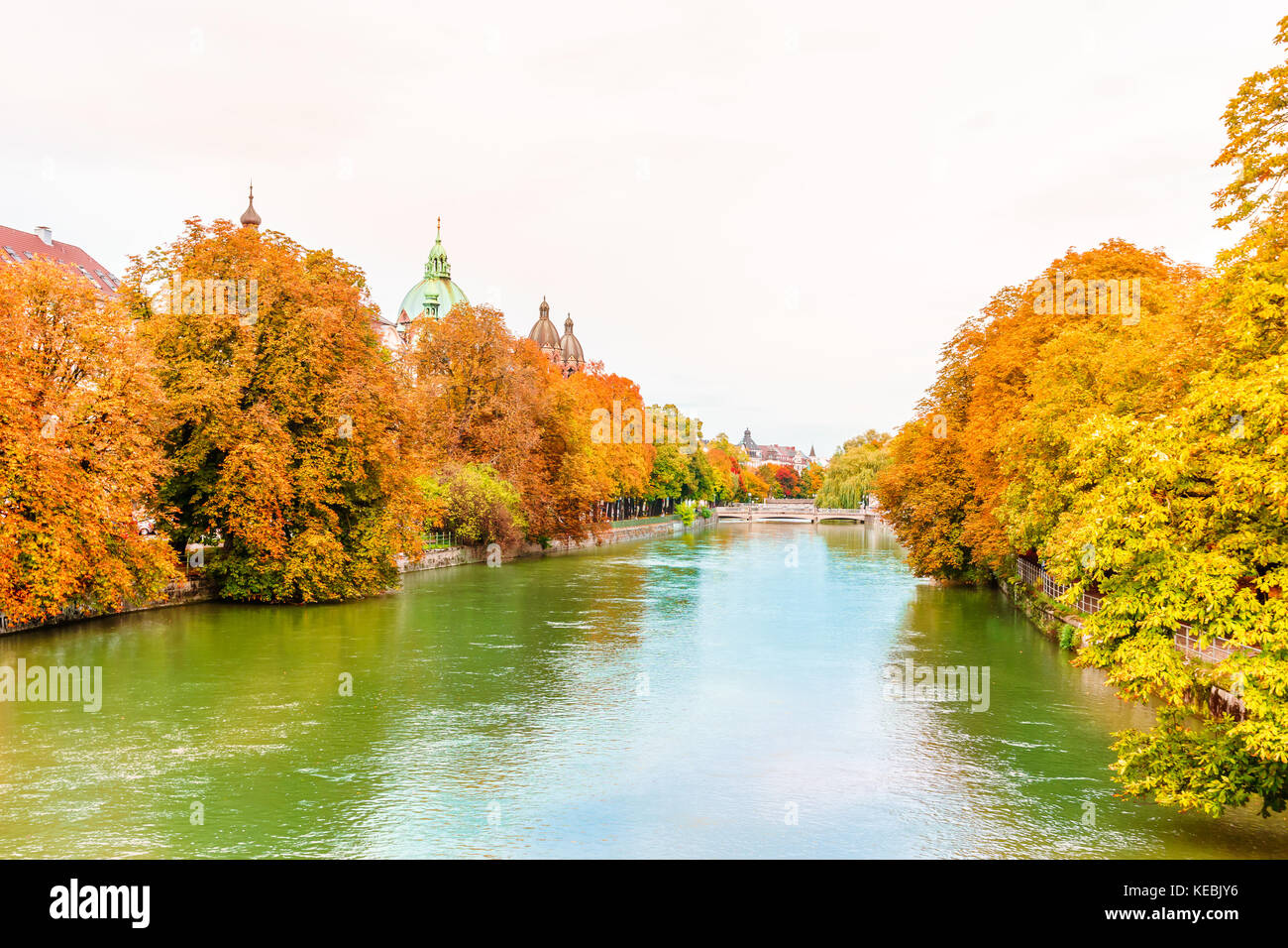View on Isar river an colorful trees in autumn landscape in Munich ...