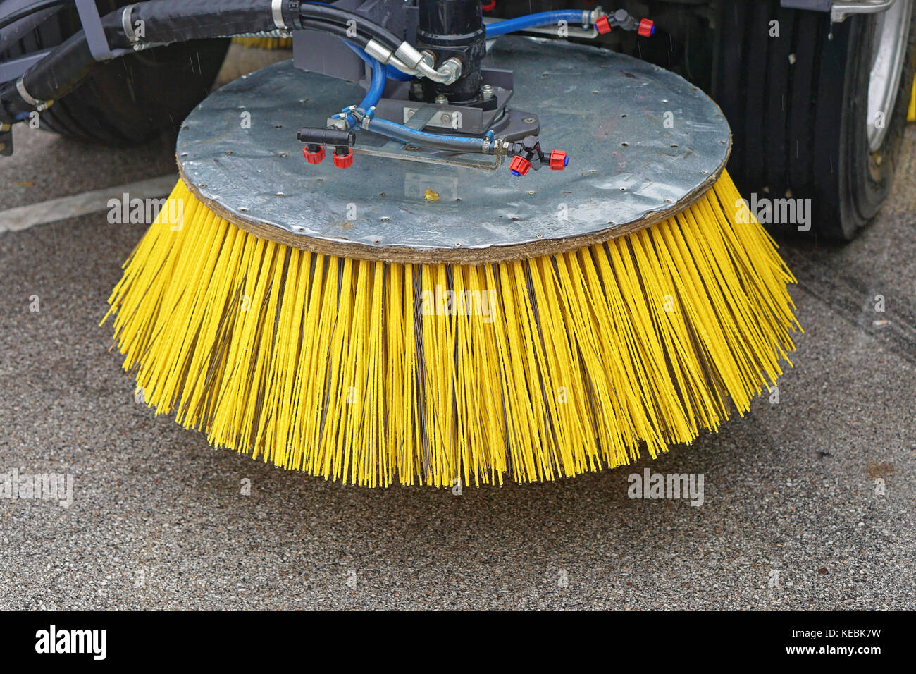 Street cleaner vehicle yellow rotating brush Stock Photo - Alamy