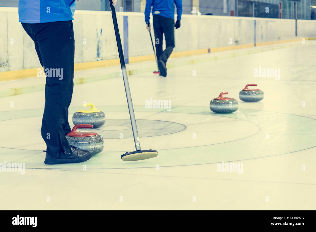 Playing a game of curling Stock Photo - Alamy