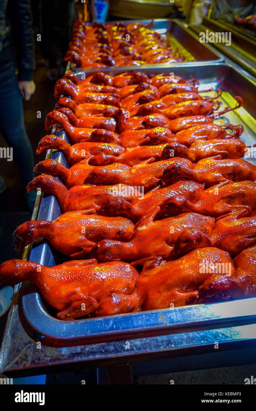 BEIJING, CHINA - 29 JANUARY, 2017: Rows of cooked ducks ready to eat ...
