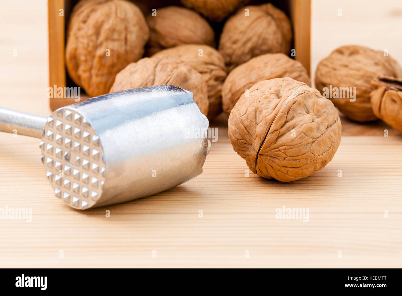 Walnuts kernels and whole walnuts on wooden background. Whole and ...