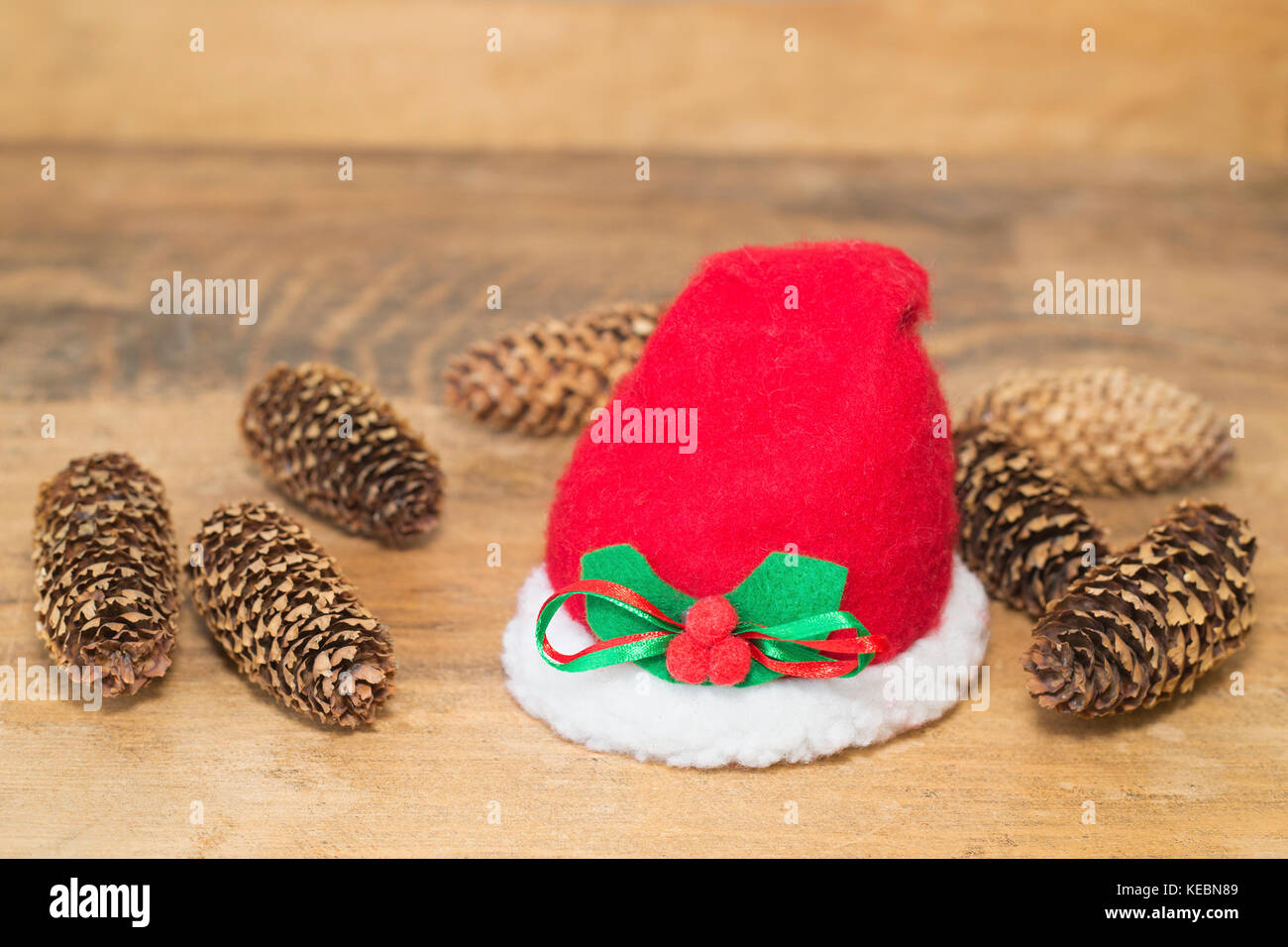 Santa Claus hat and spruce cones Stock Photo - Alamy