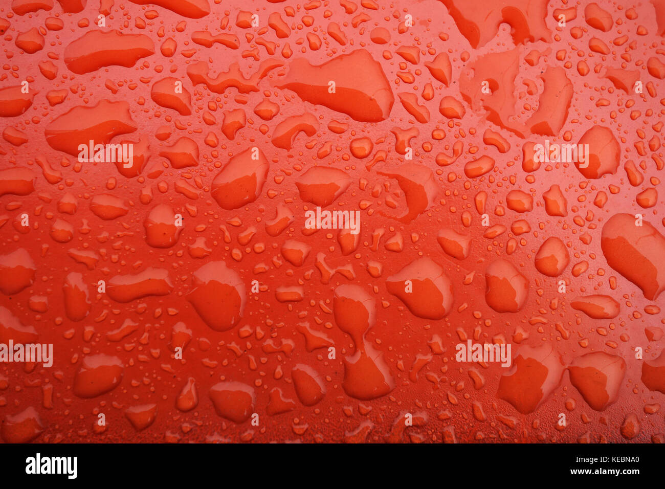 Water droplet with the red metallic background Stock Photo - Alamy