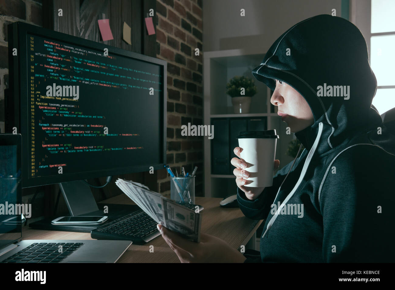 beautiful programmer hacker drinking hot coffee relaxing and holding ...