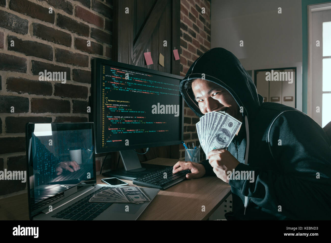 evil hacker holding dollar cash banknote cover face smiling and looking ...
