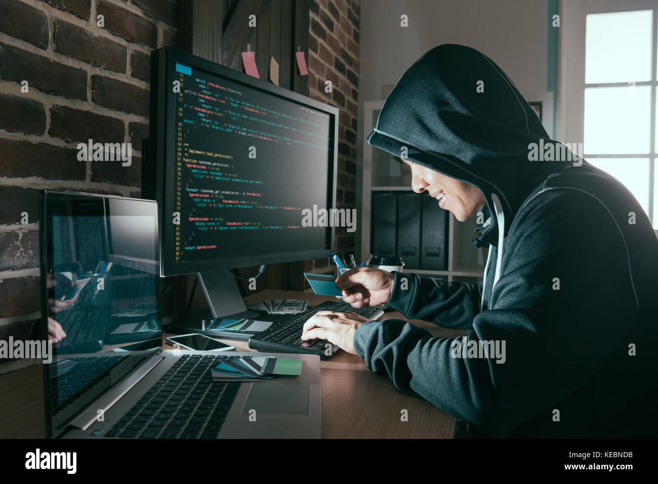 young hacker stolen credit card and using online data system steal ...