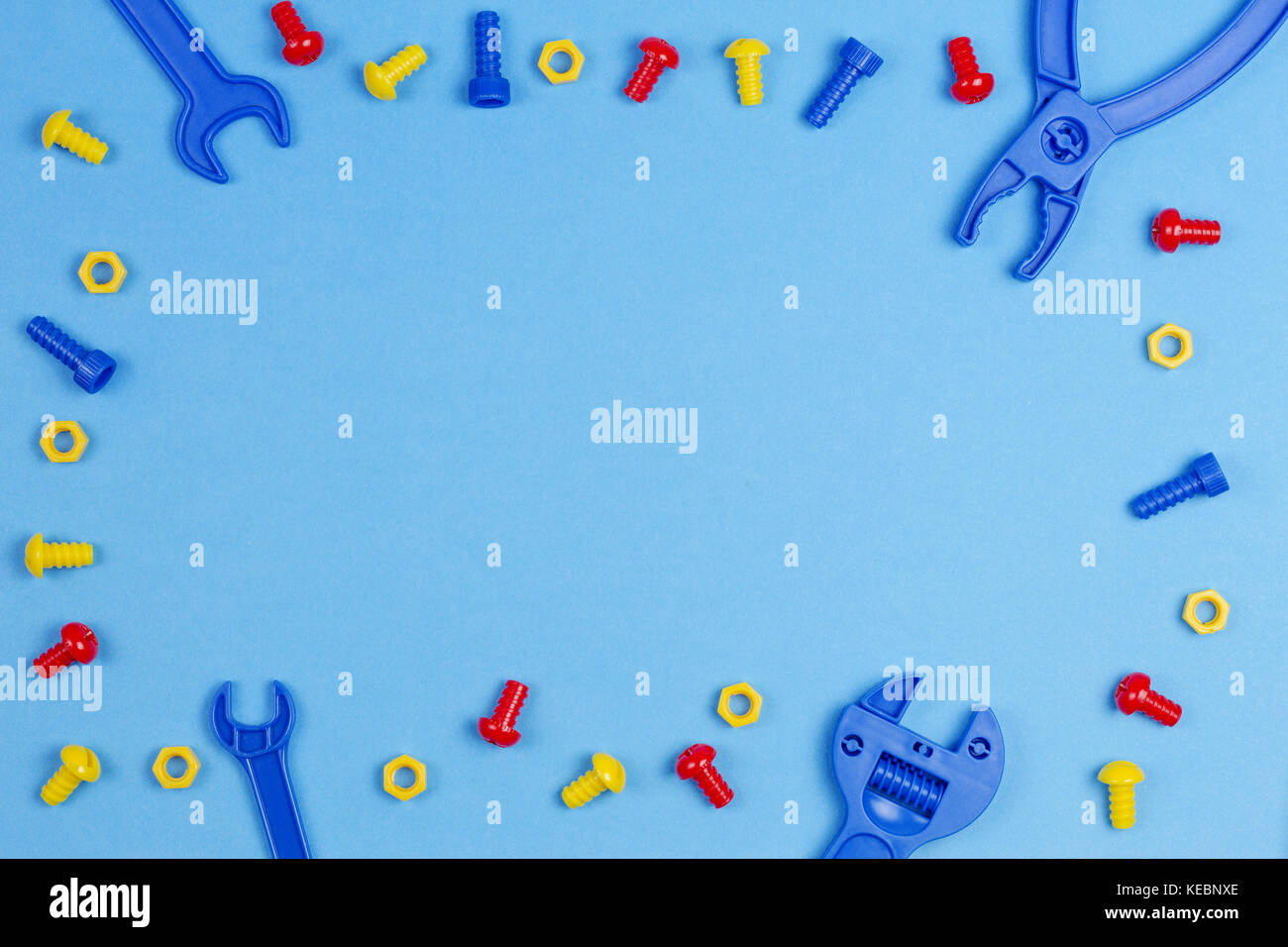 Colorful kid toy tools on light blue background, top view Stock Photo ...