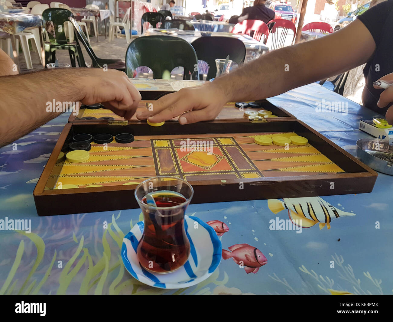 two people playing backgammon at a village coffeehouse Stock Photo - Alamy
