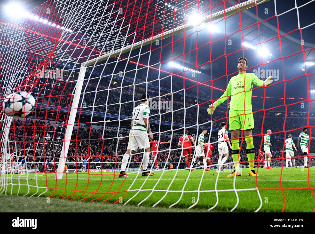 Munich, Germany. 18th Oct, 2017. Munich's Mats Hummels (2-L) scores 3-0 ...