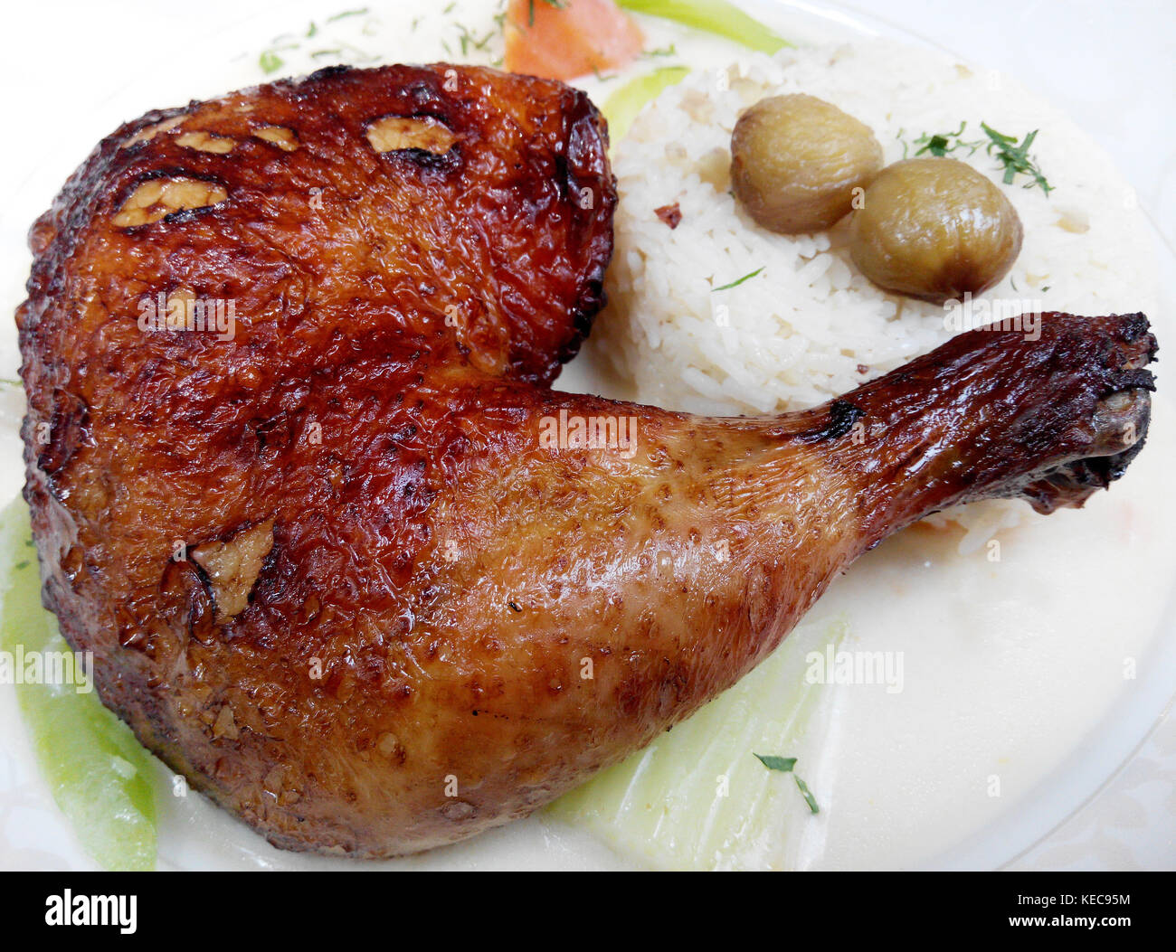 Baked chicken legs with rice and vegetables Stock Photo - Alamy