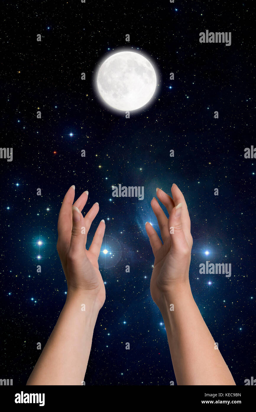 female open hands and moon Stock Photo - Alamy