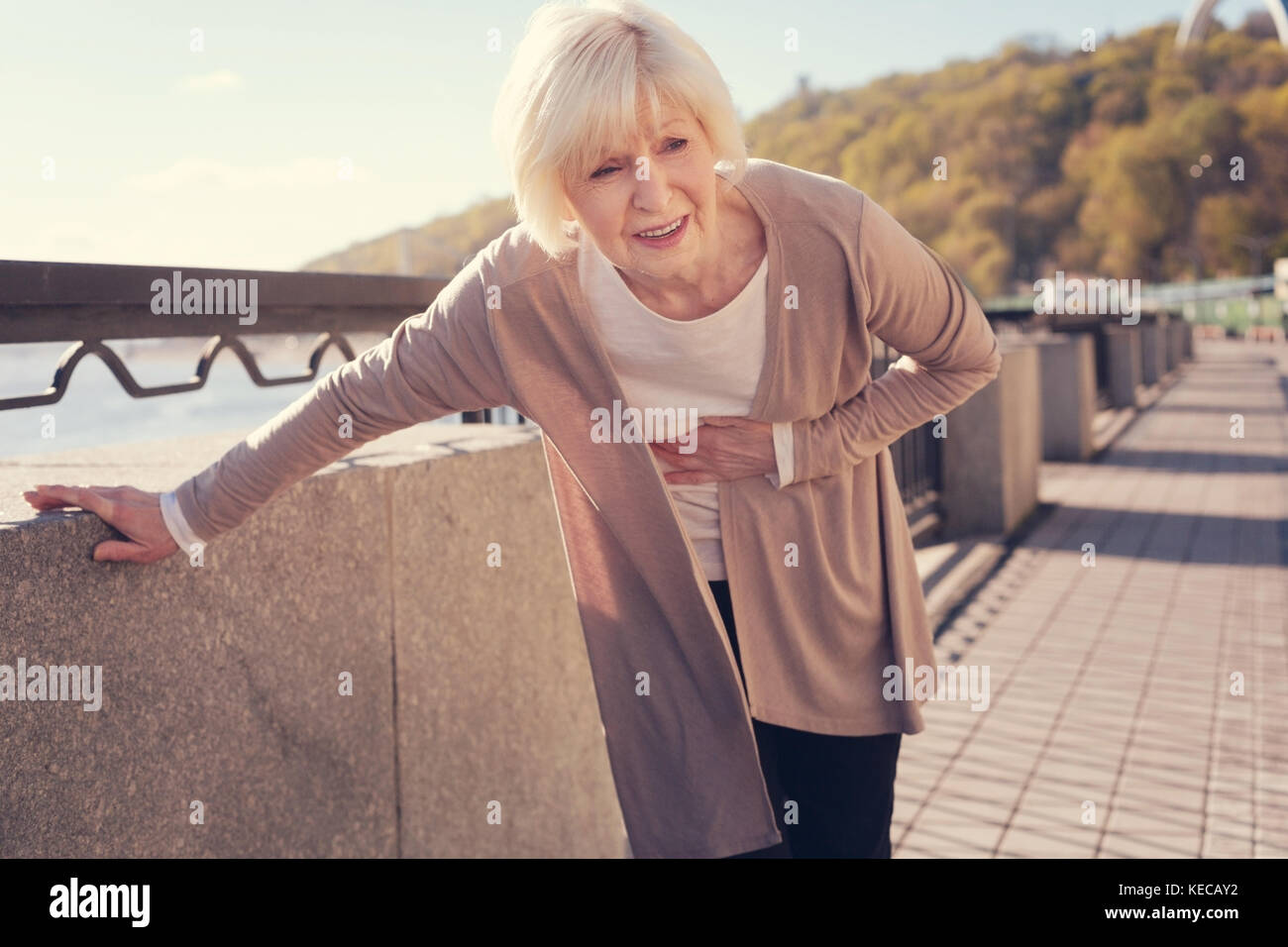 Writhing with pain hi-res stock photography and images - Alamy