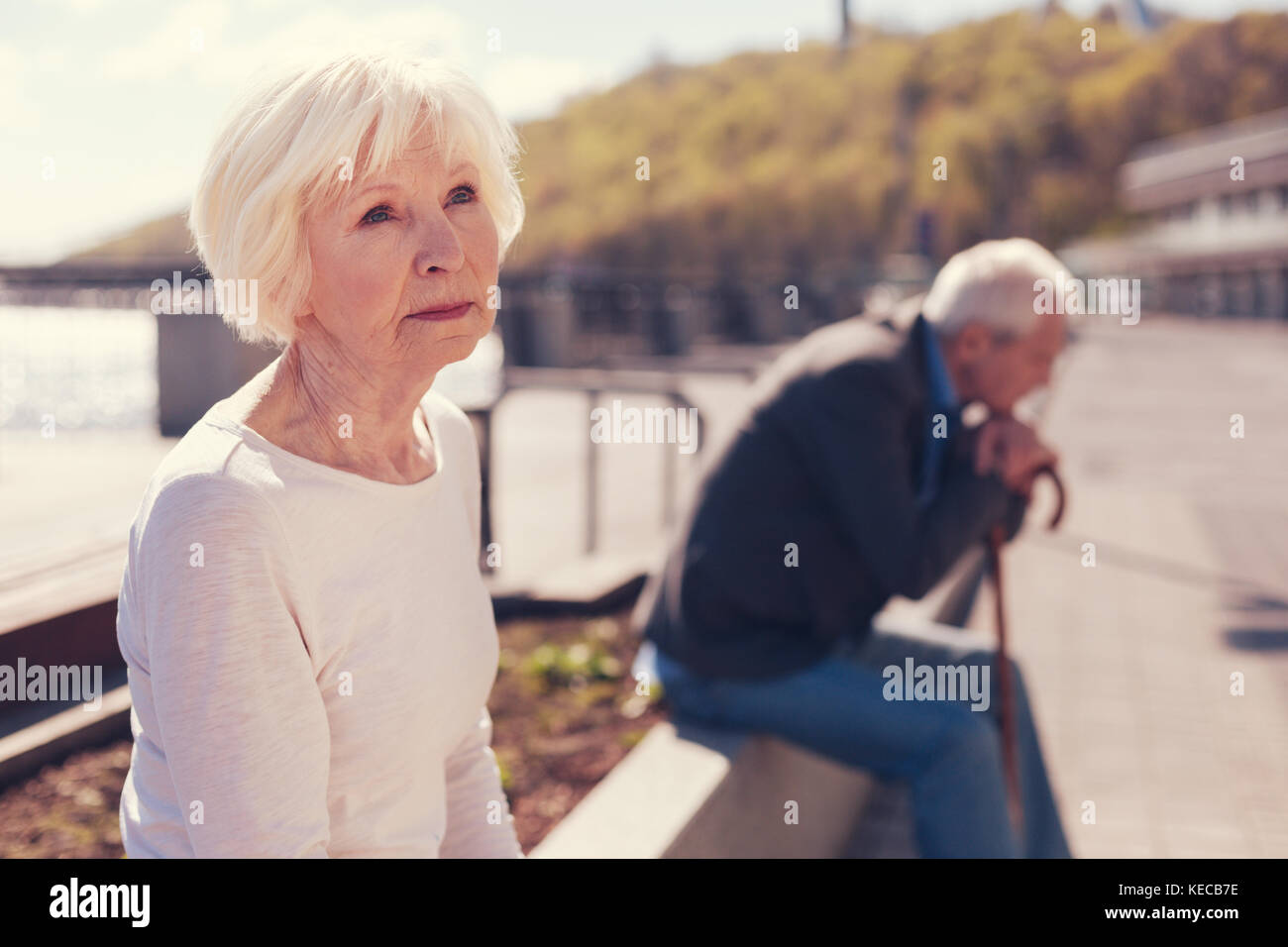 Elderly couple being absorbed into unsettling thoughts Stock Photo - Alamy