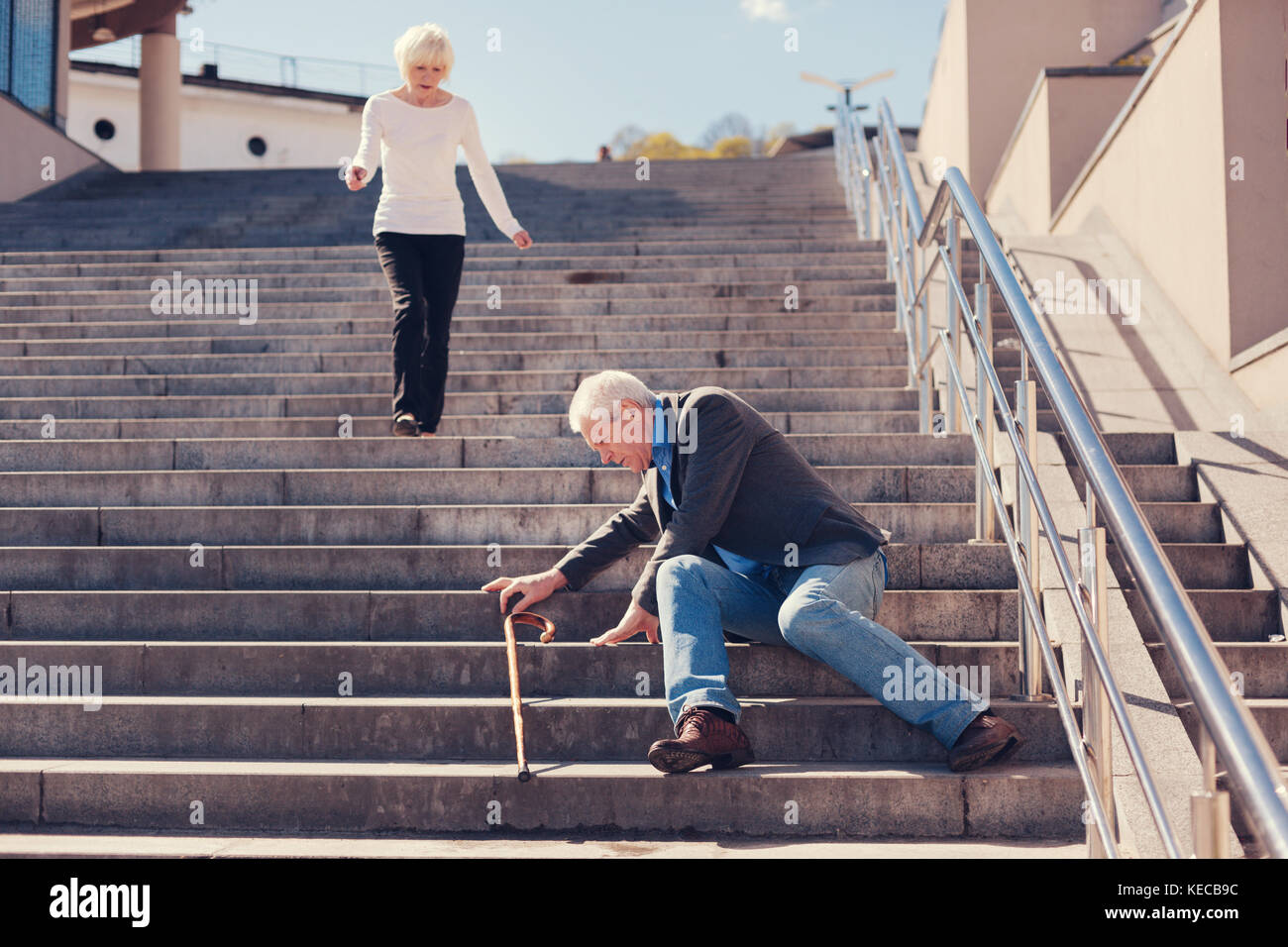 Senior walking down stairs hi-res stock photography and images - Alamy