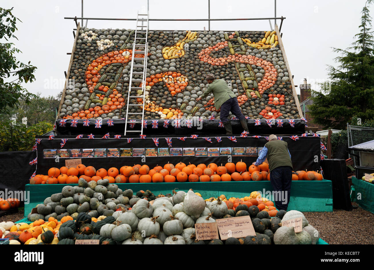 Artist Mark Ford puts the final touches to a Snakes and Ladders themed ...