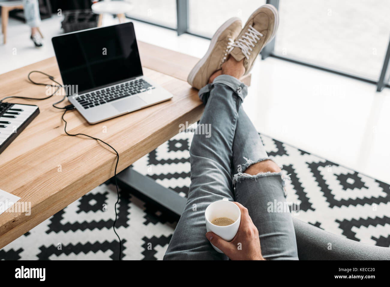 musician drinking coffee at workplace Stock Photo - Alamy