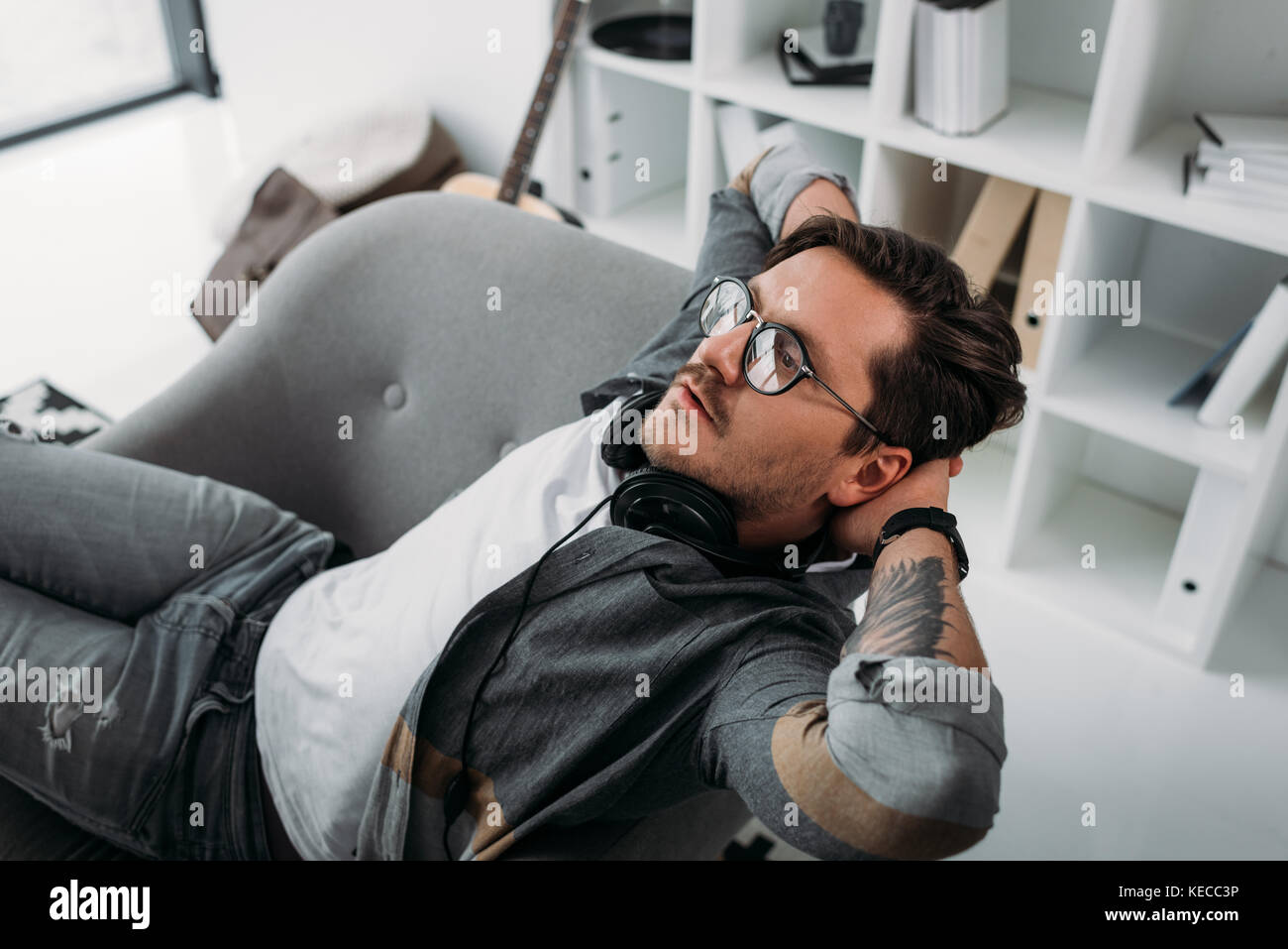 man relaxing at modern office Stock Photo - Alamy