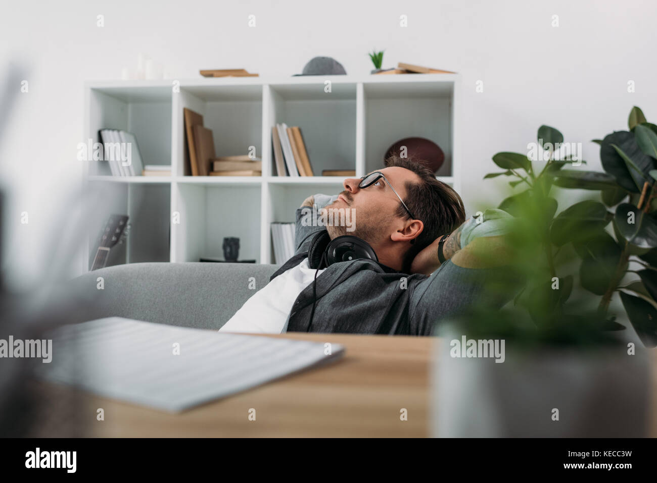 man relaxing at modern office Stock Photo - Alamy