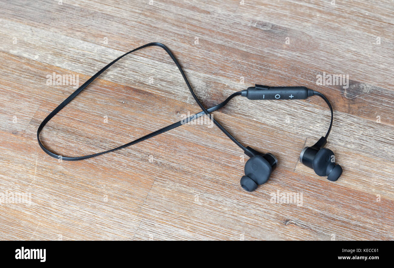 Modern wireless earplugs, waiting to be used Stock Photo - Alamy