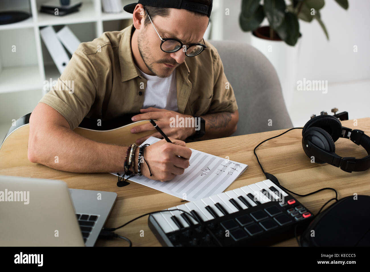 young musician writing notes Stock Photo - Alamy